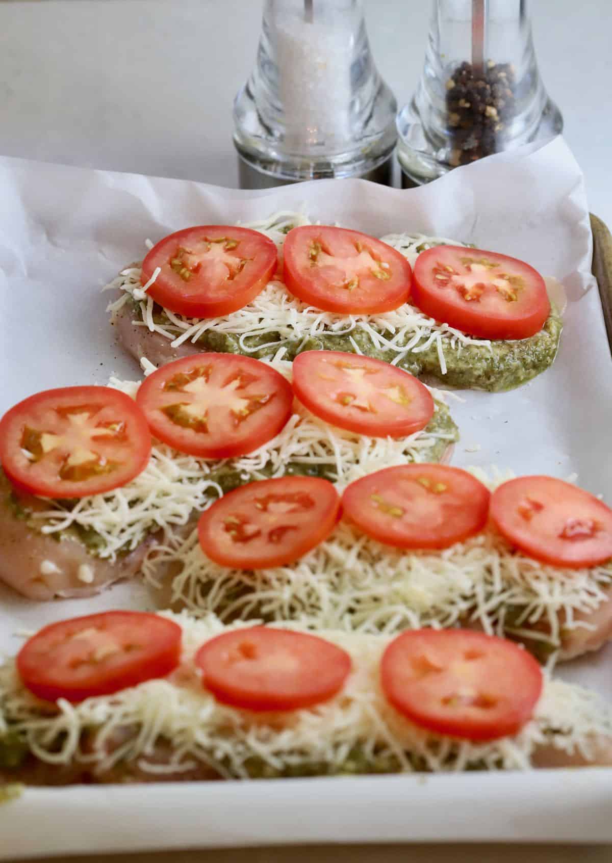 Baked Pesto Chicken Recipe | gritsandpinecones.com