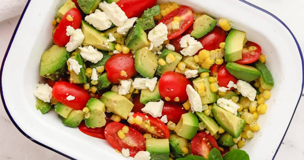 Tomato Avocado Feta Salad with Fresh Corn - Grits and Pinecones