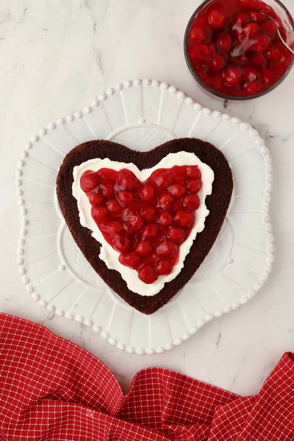 Heart-Shaped Chocolate Cake with Cherries - Grits and Pinecones