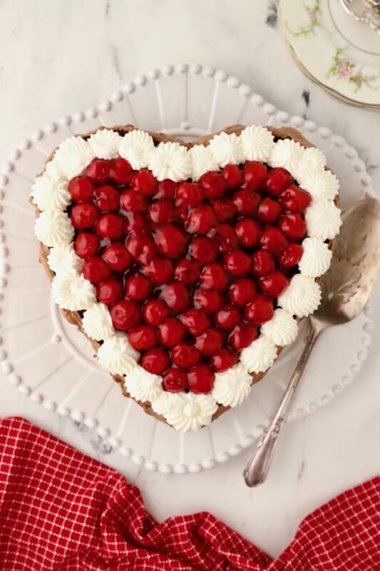 Heart-Shaped Chocolate Cake with Cherries - Grits and Pinecones