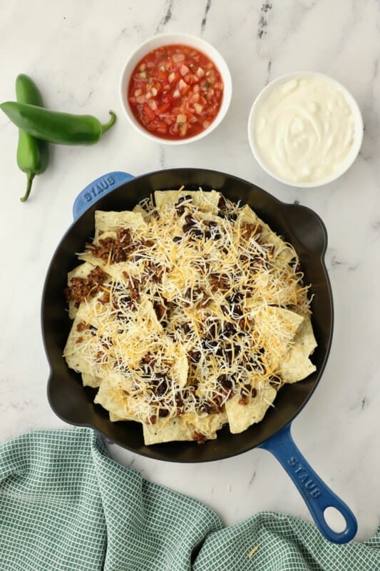 Easy Cast-Iron Layered Macho Nachos - Grits and Pinecones